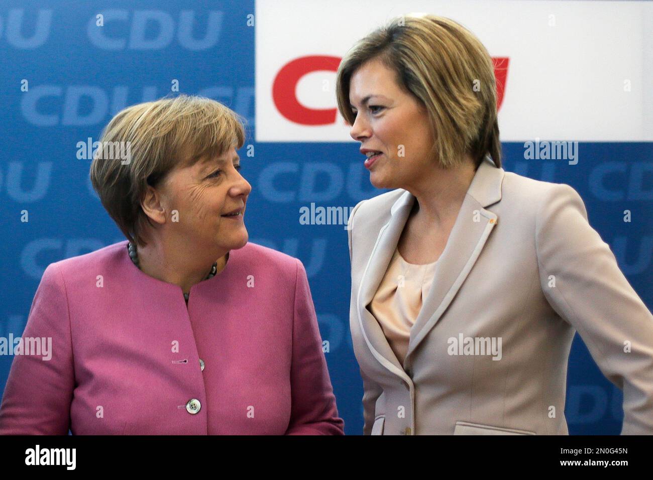 German Chancellor Angela Merkel, left, talks to board member Julia ...