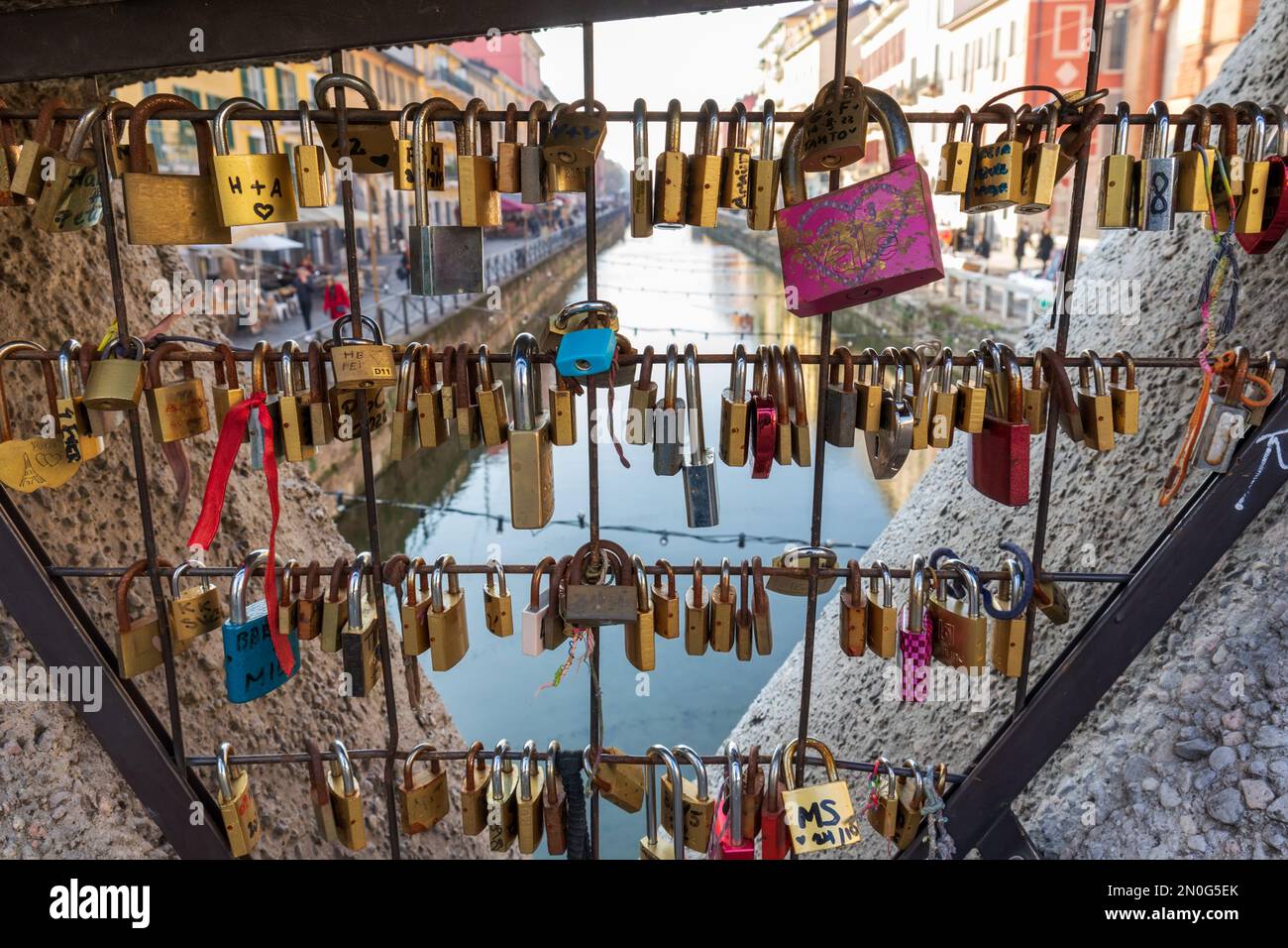 Lots of small and interlocking keys on the bridge railing and a view of ...