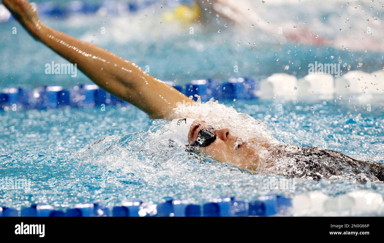 Natalie Coughlin competes in the women's 100-meter backstroke during ...