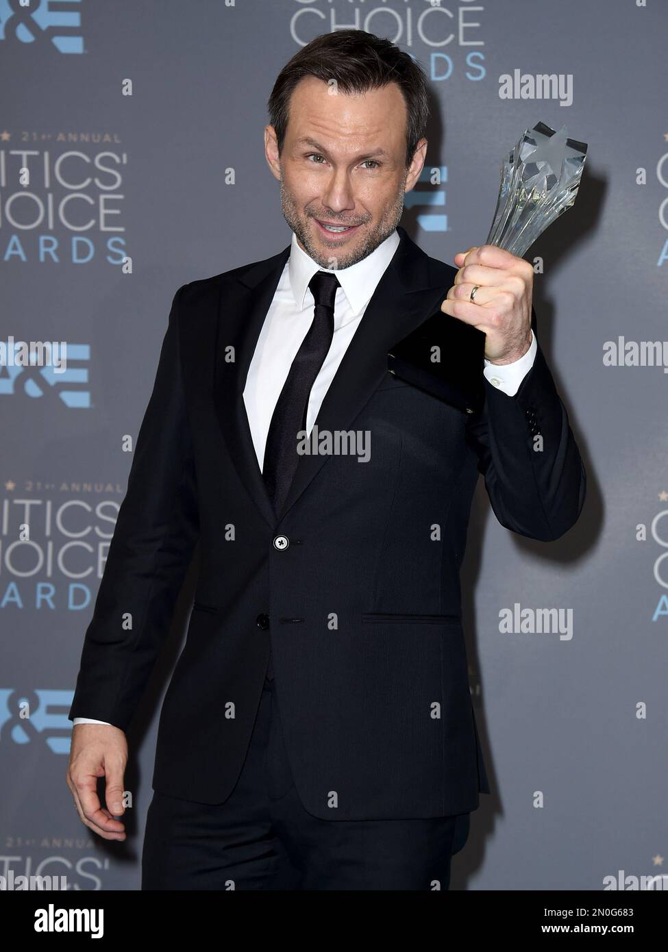 Christian Slater poses in the press room with the award for best ...