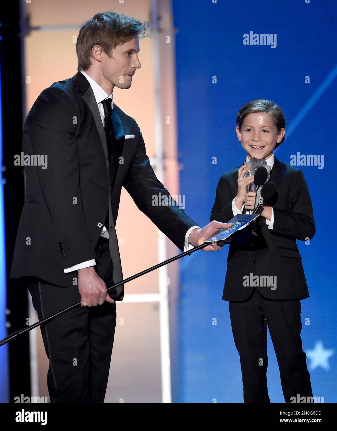 Bradley James, left, holds the microphone for Jacob Tremblay as he ...