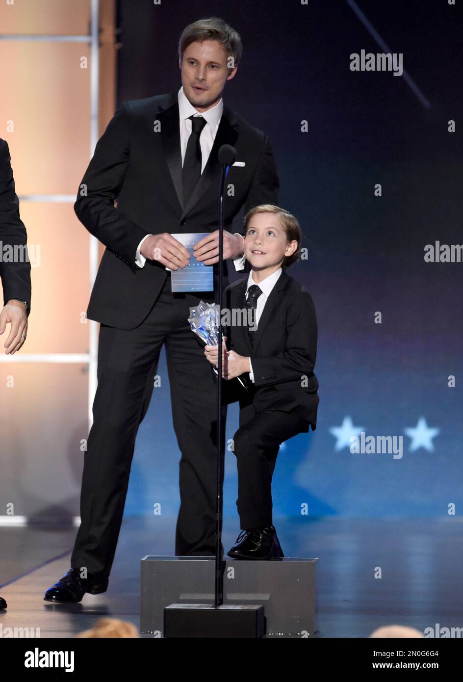 Bradley James, left, presents Jacob Tremblay with the award for best ...