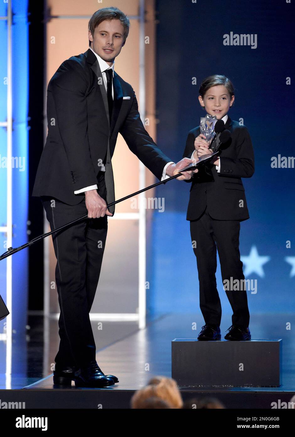 Bradley James, left, holds the microphone for Jacob Tremblay as he ...