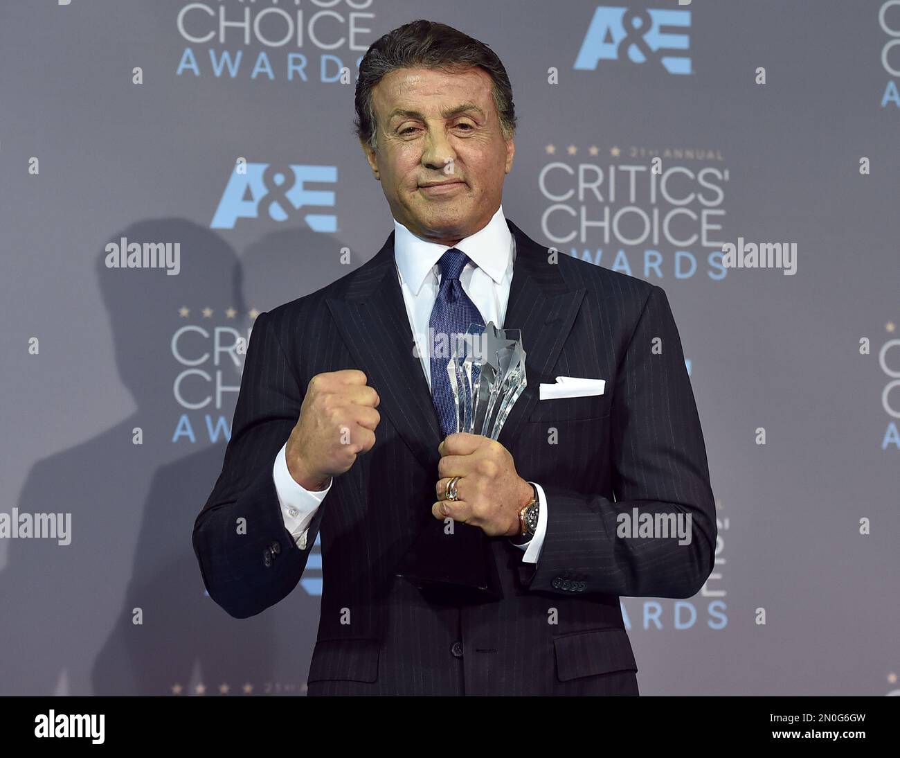 Sylvester Stallone poses in the press room with the award for best ...