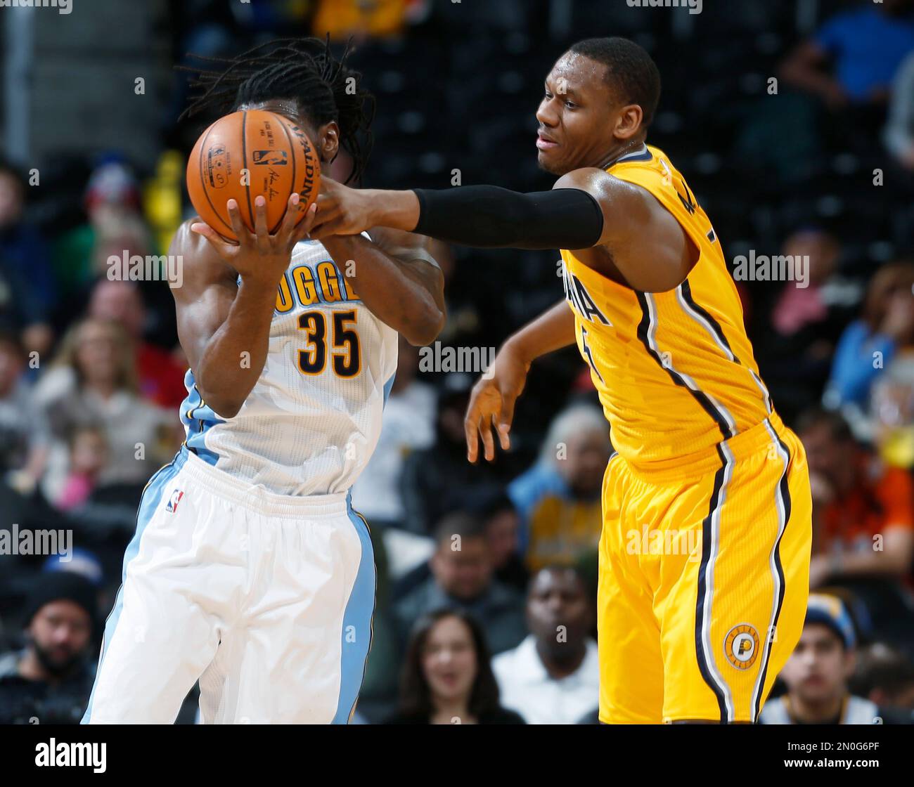 Indiana Pacers forward Lavoy Allen, right, swats the ball out of the ...