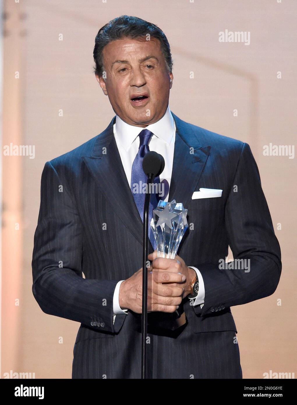 Sylvester Stallone accepts the award for best supporting actor for ...
