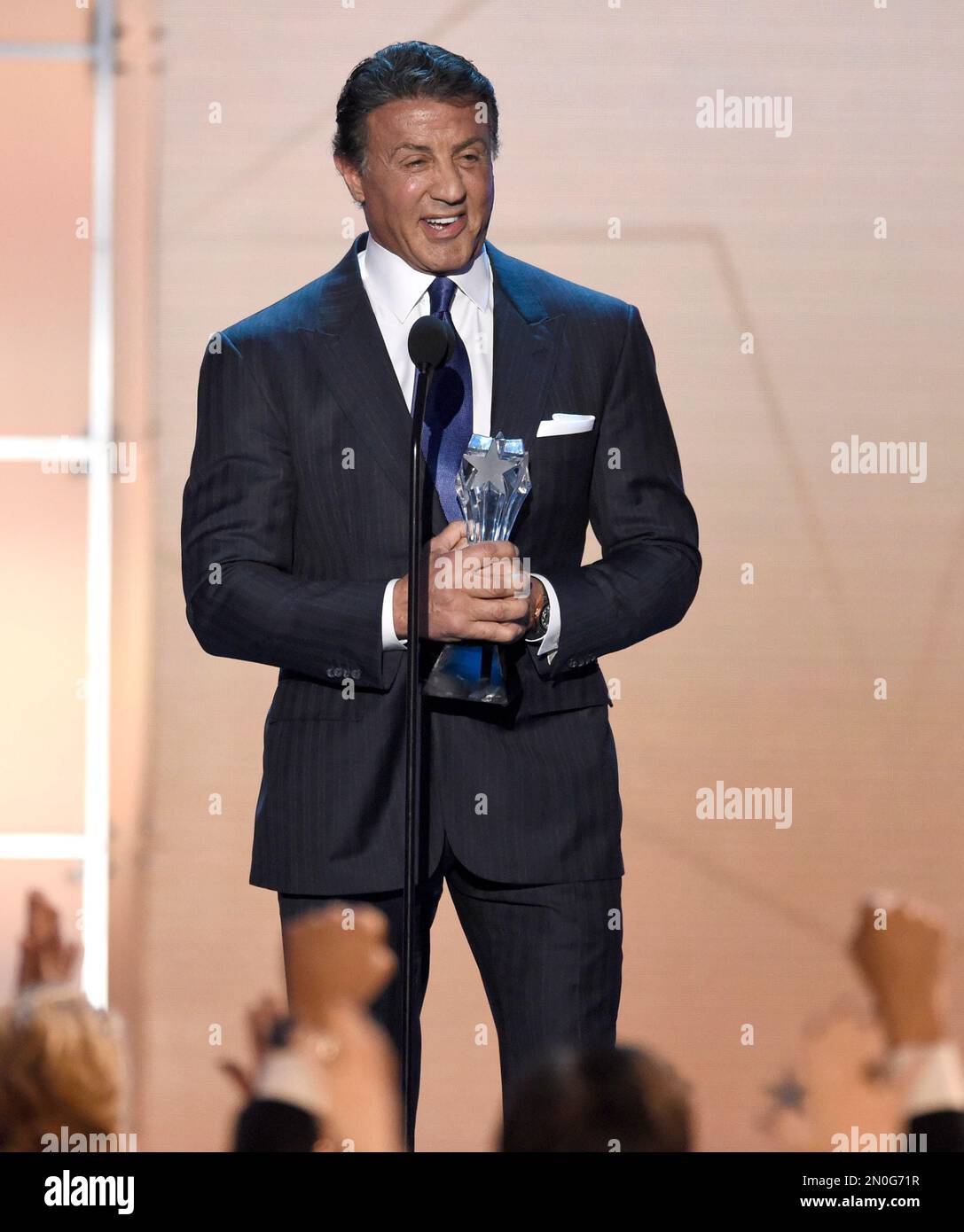 Sylvester Stallone accepts the award for best supporting actor for ...