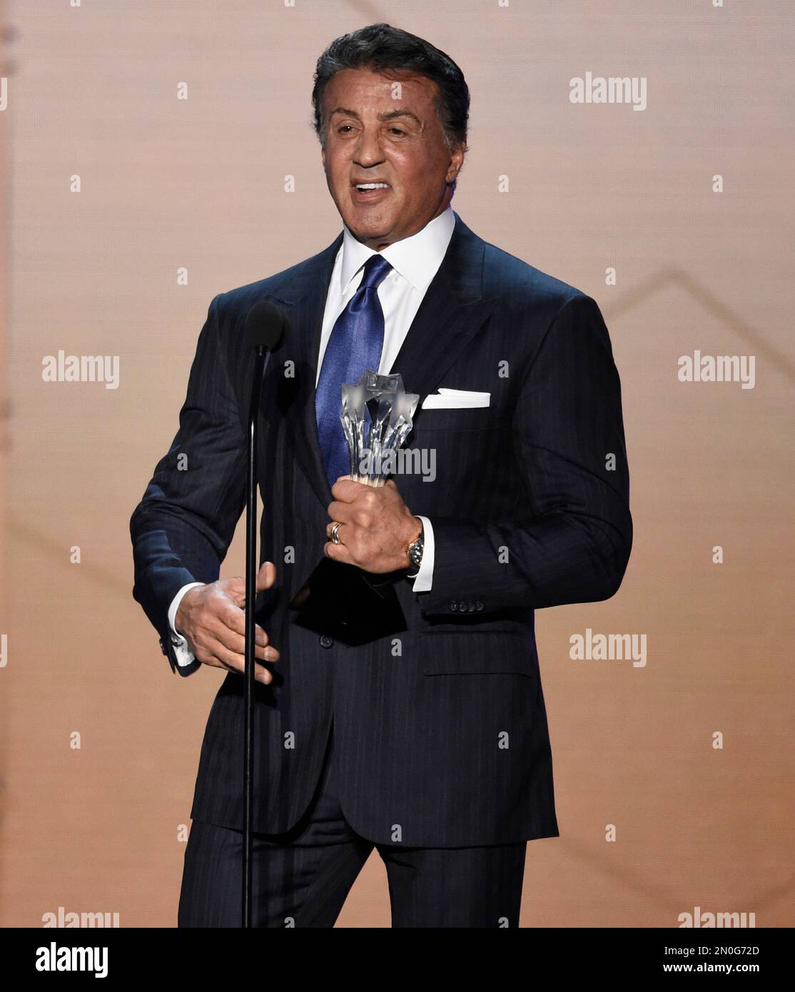 Sylvester Stallone accepts the award for best supporting actor for ...