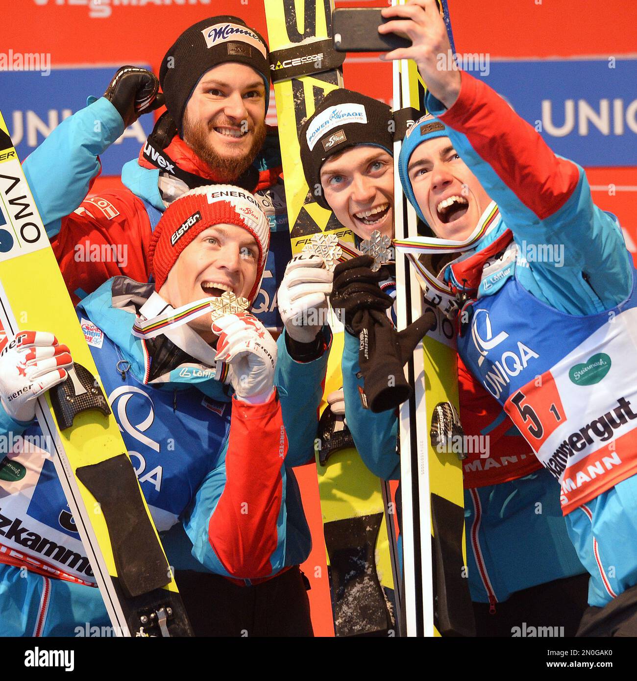 Austria's bronze medal winning ski jumping team, from left, Michael ...