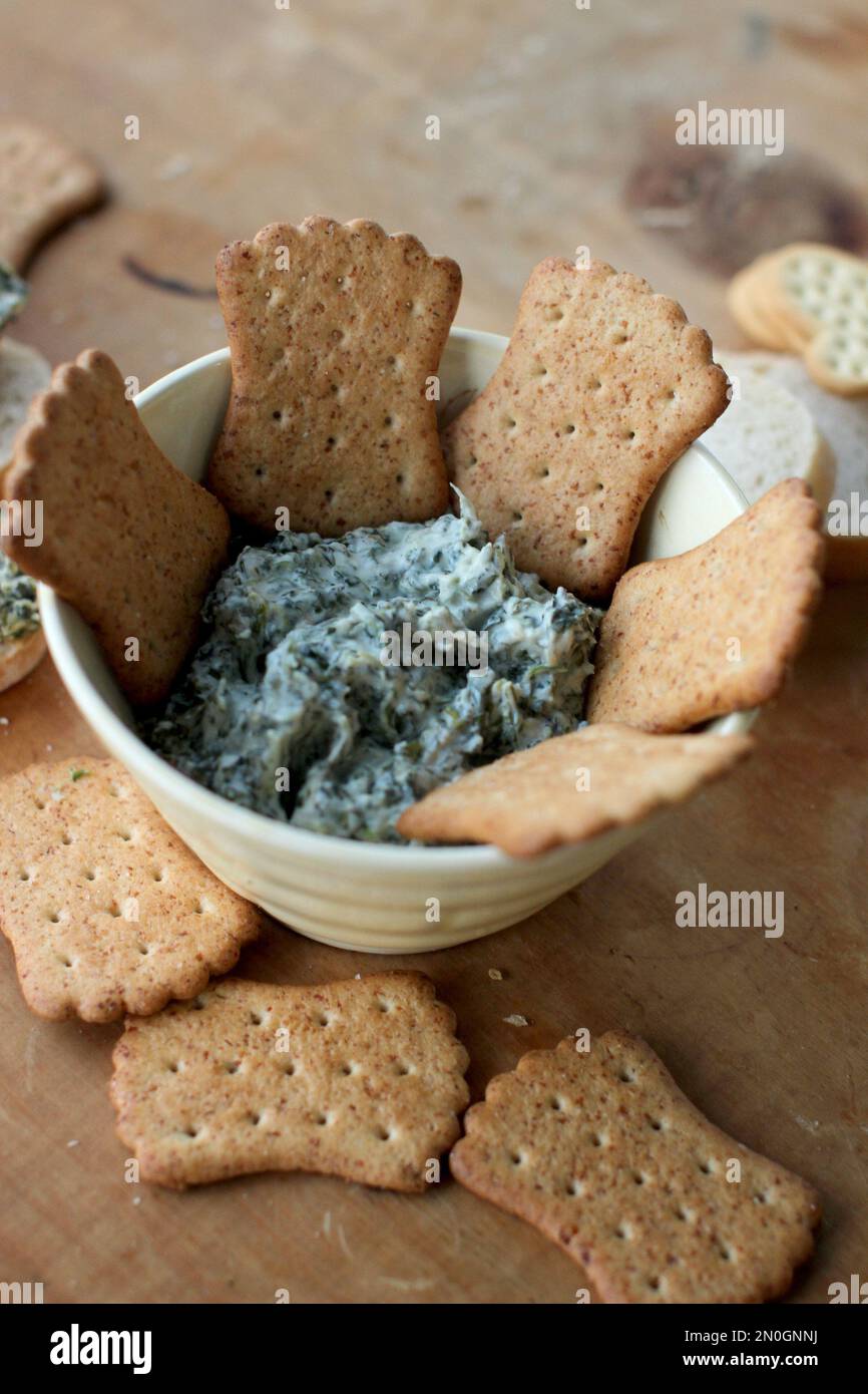 This Nov. 2, 2015 photo shows hot and creamy pesto spinach dip in ...