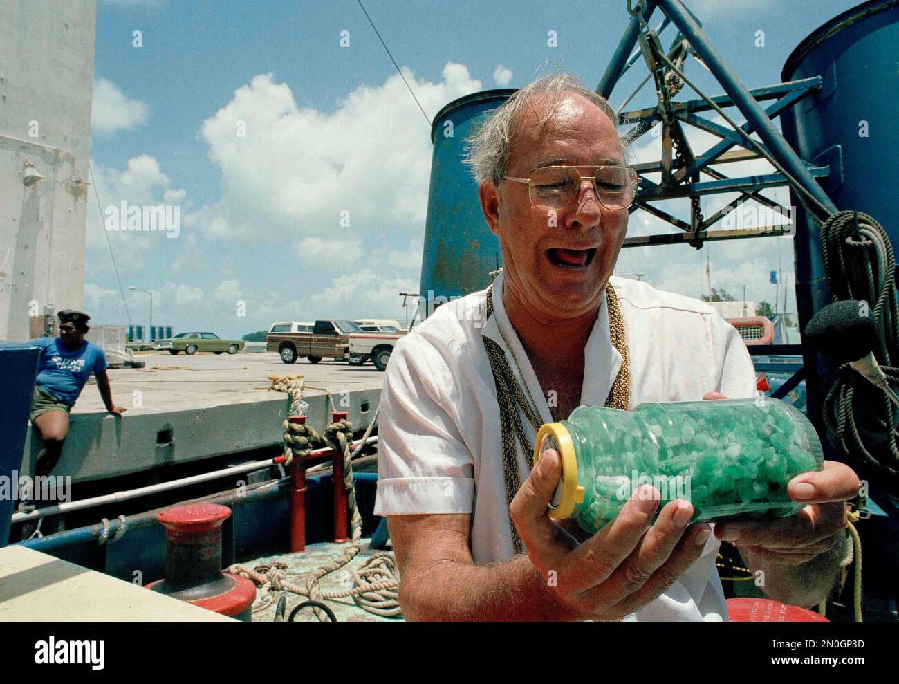 Mel Fisher of Treasure Salvors Inc. examines some 2,300 emeralds found ...