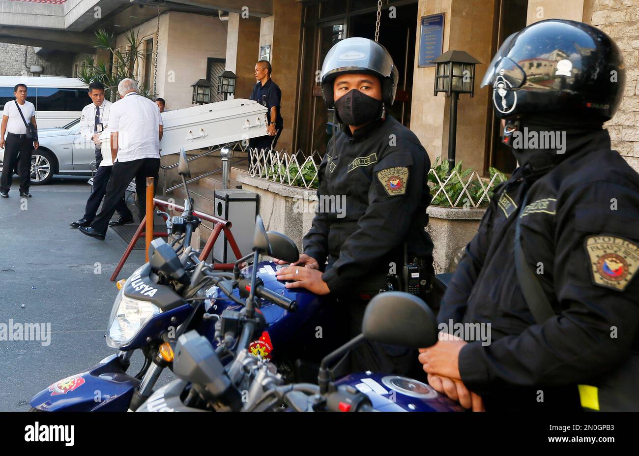 Philippine National Police SWAT members prepare to escort the coffin of ...