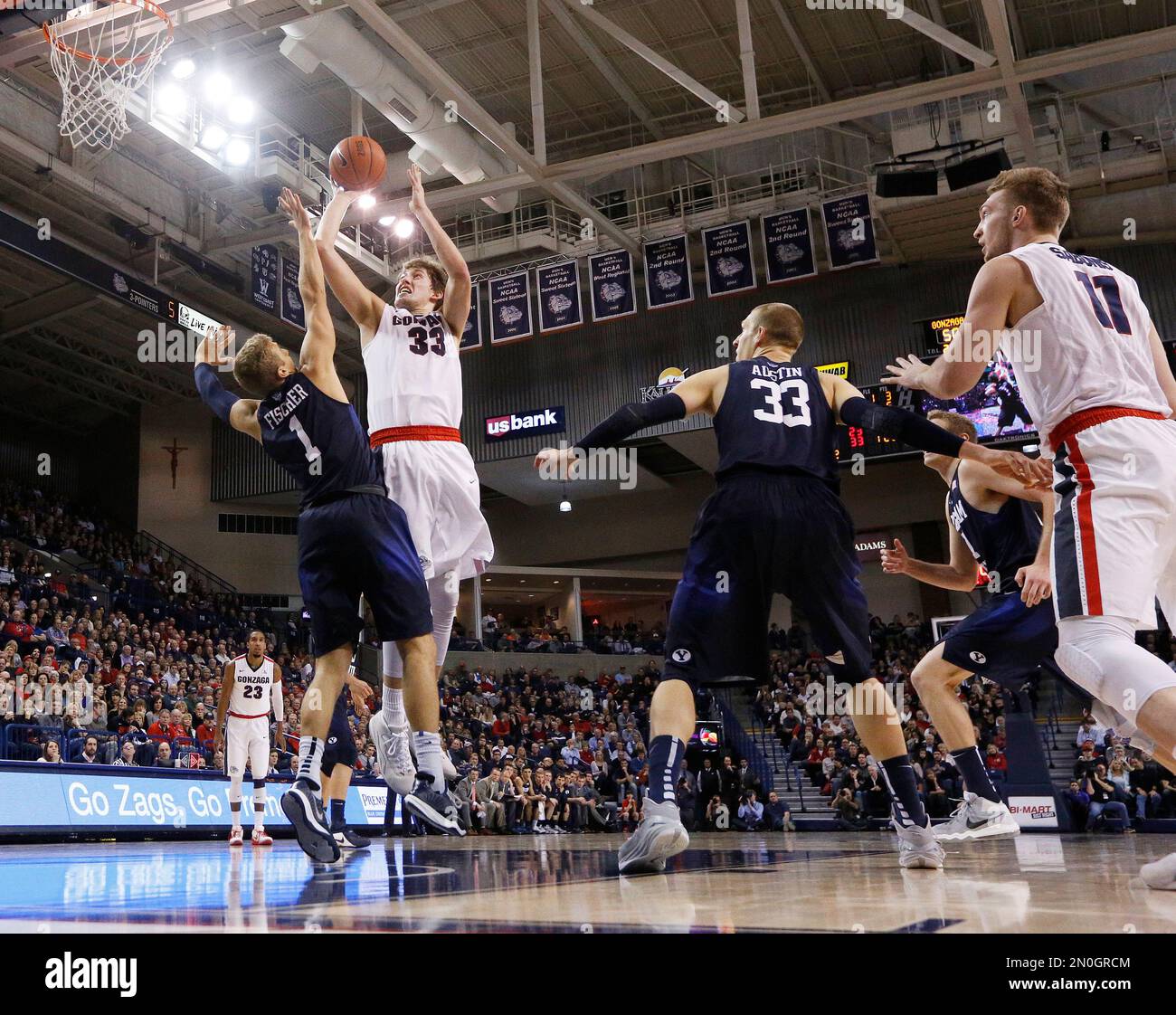 Gonzaga's Kyle Wiltjer (33) shoots against BYU's Chase Fischer (1 ...