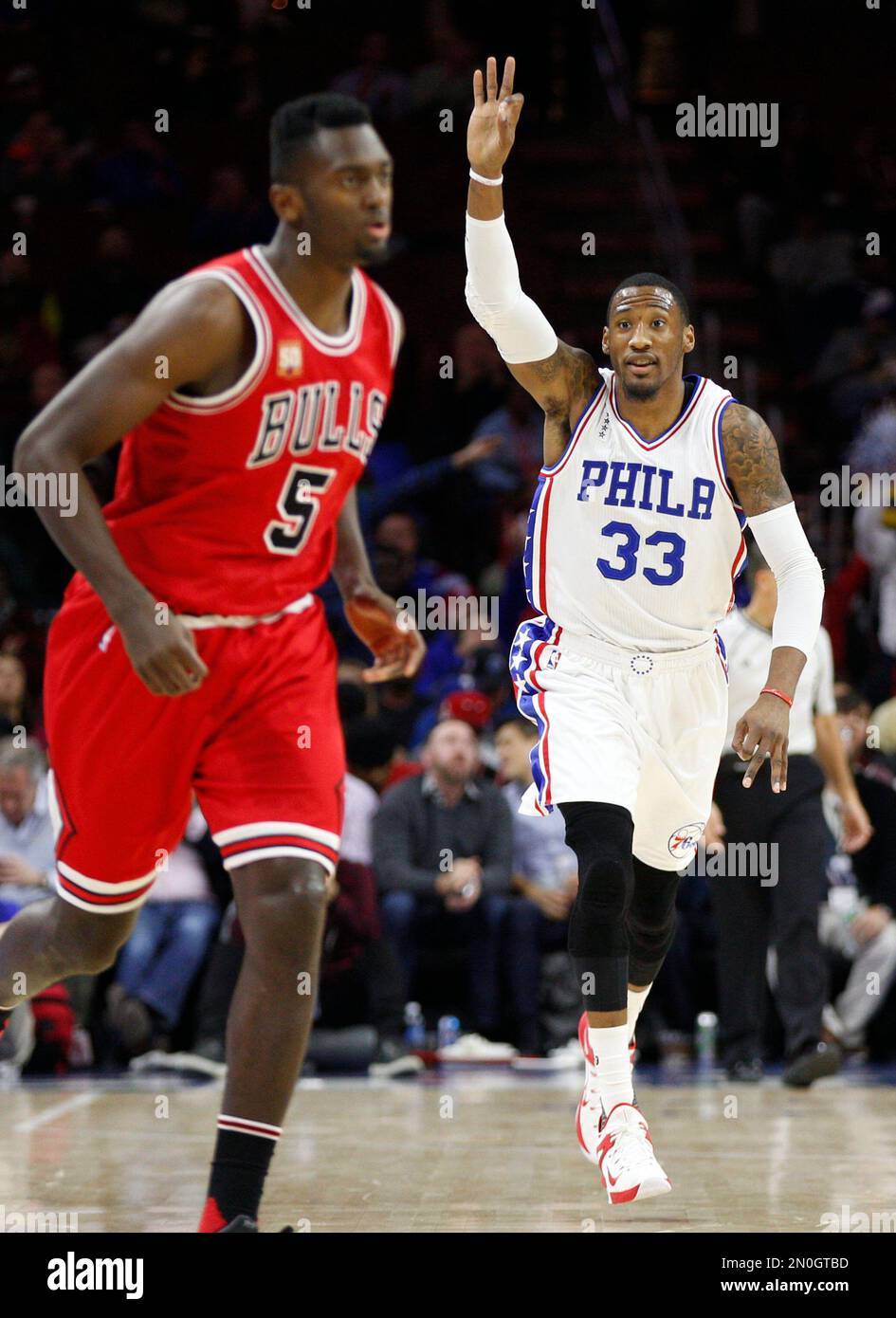 Philadelphia 76ers' Robert Covington, right, reacts to his 3-point ...
