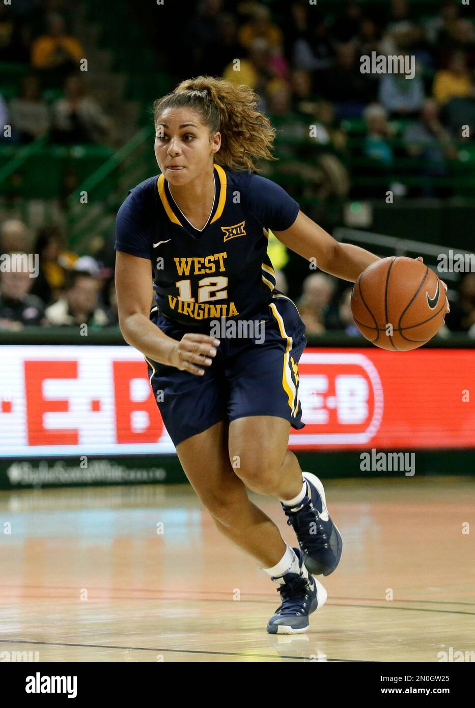West Virginia guard Chania Ray (12) moves the ball against Baylor ...