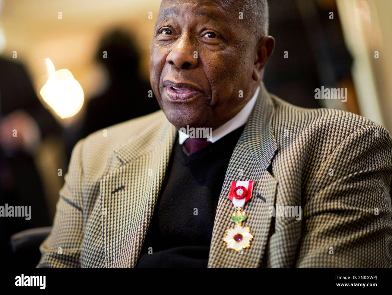 Hank Aaron looks on after being presented with the Order of the Rising ...