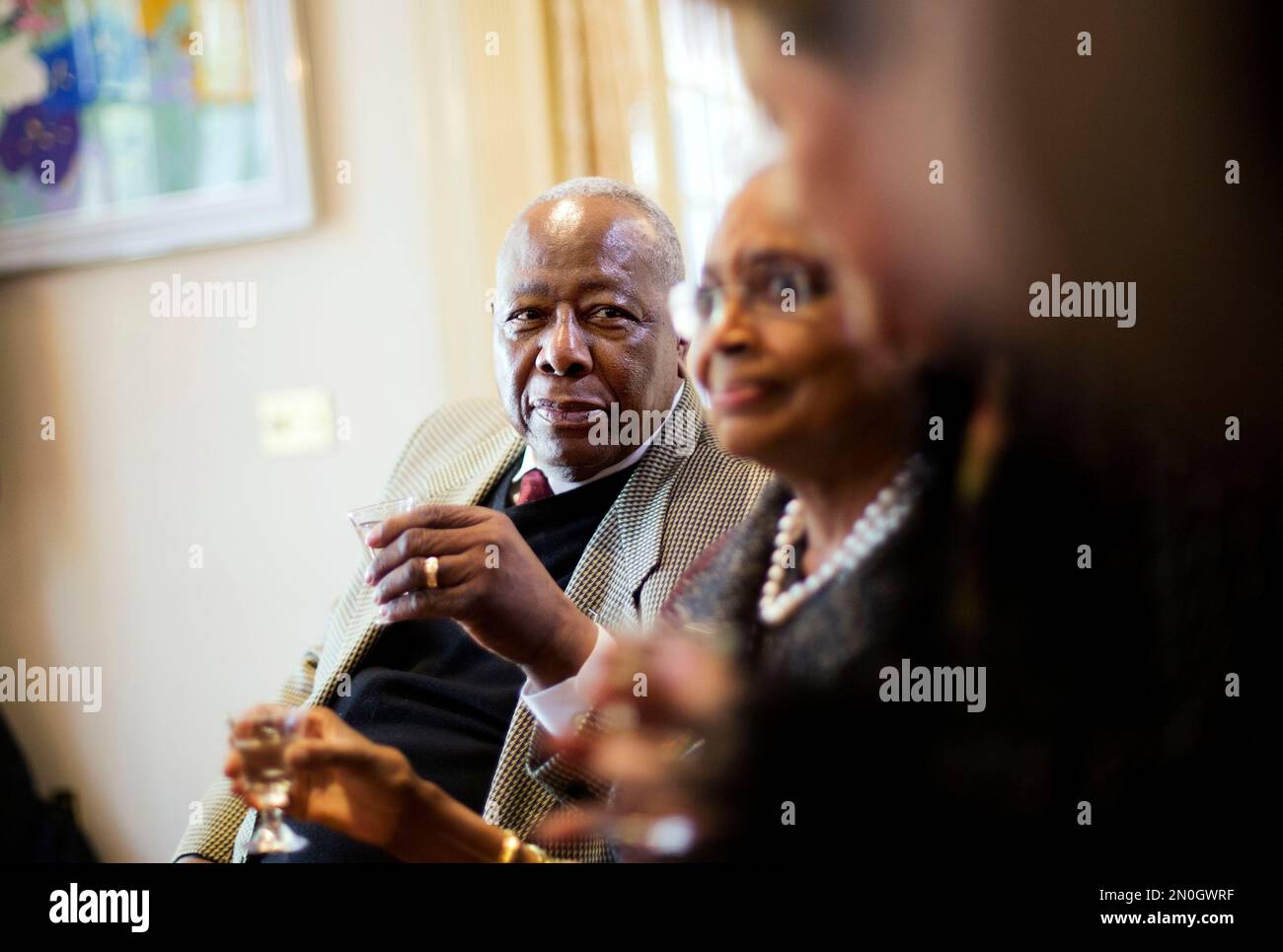 Hank Aaron, left, joins a toast with wife Billye after being presented ...