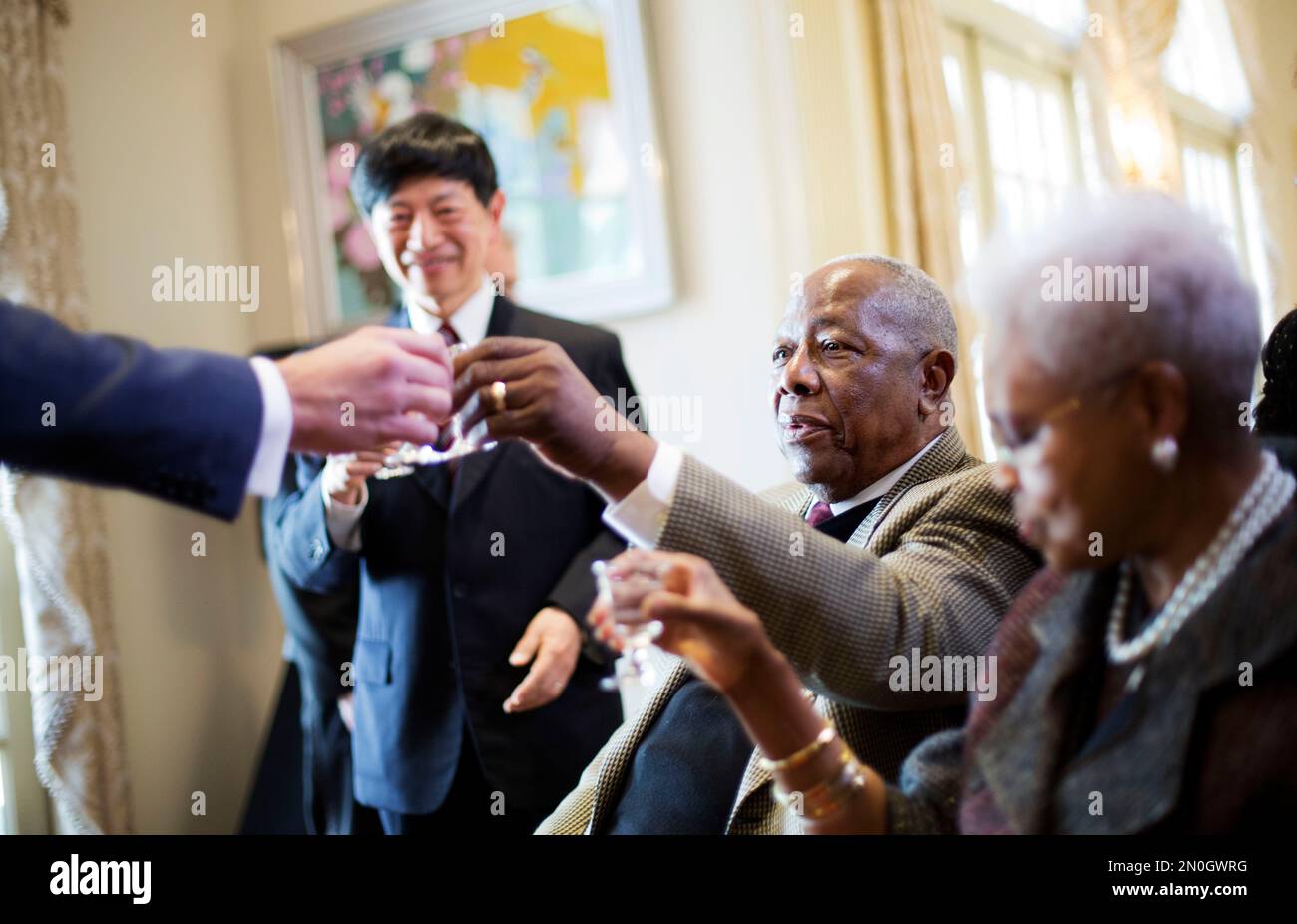Hank Aaron, center, joins a toast with Consul General of Japan in ...