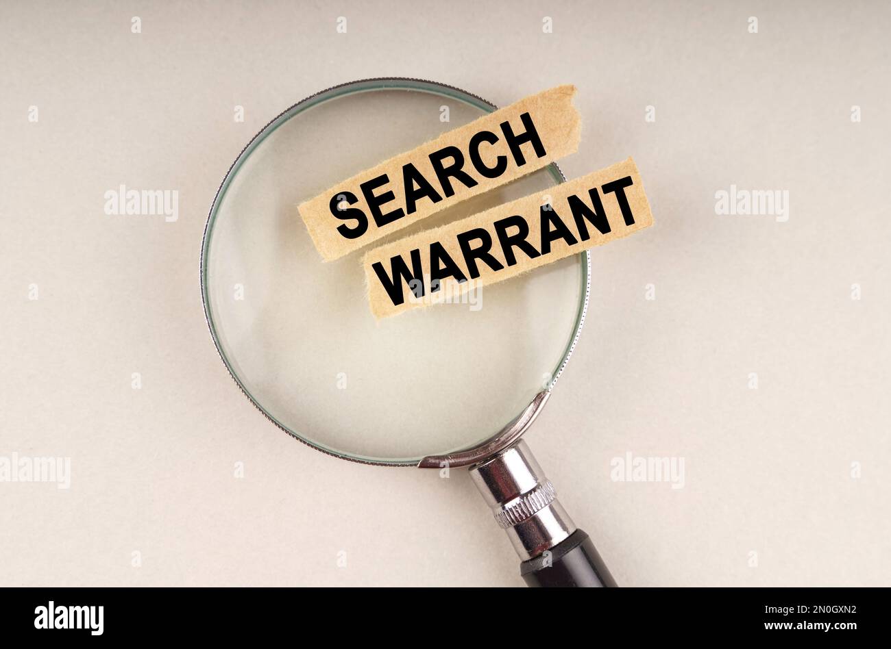 On the magnifying glass are paper strips with the inscription - Search ...