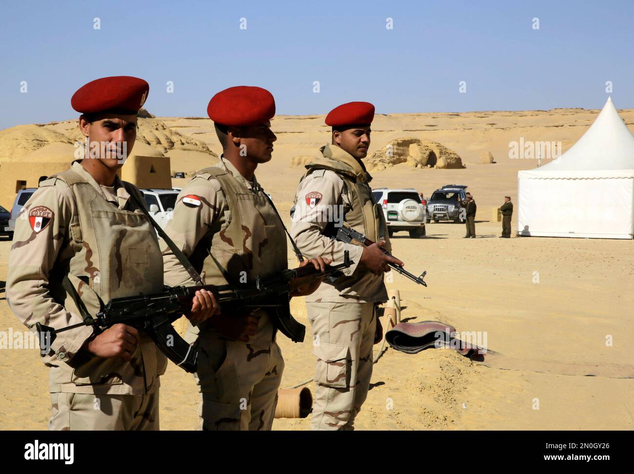 Egyptian Army soldiers stand guard outside the Wati El Hitan Fossils ...