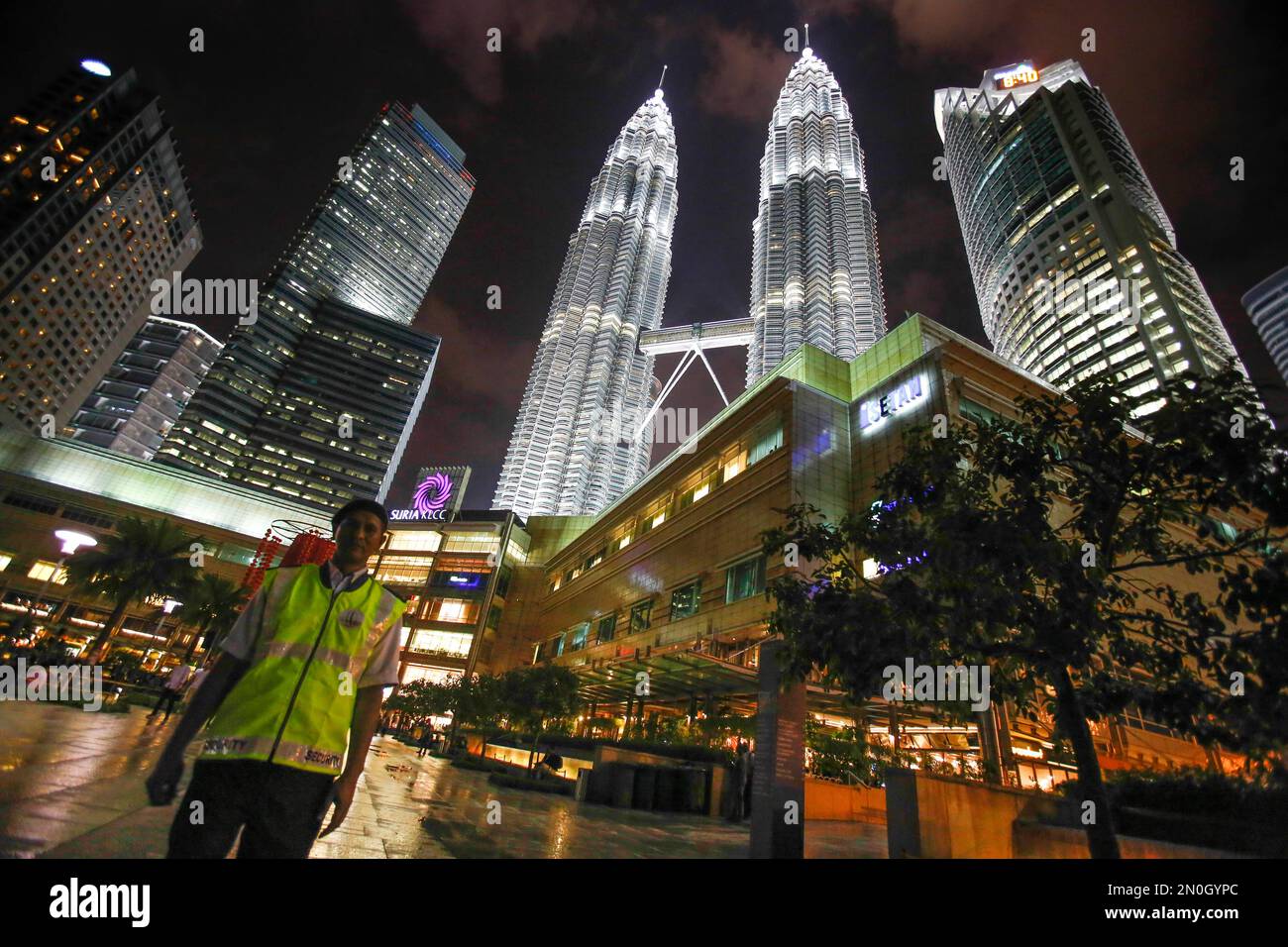 A security guard patrols in front of Malaysia's iconic building ...
