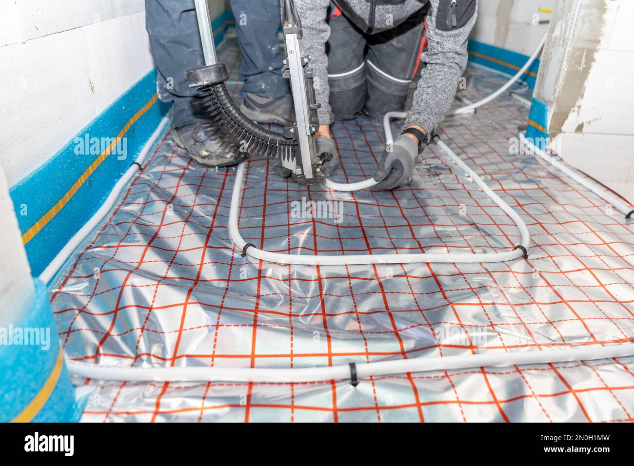 installation of underfloor heating in a new building Stock Photo - Alamy