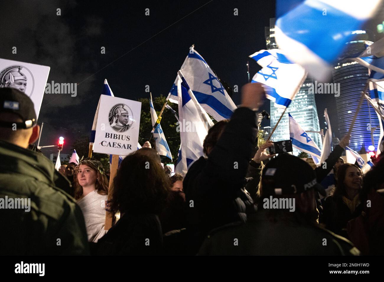 Israel. 04th Feb, 2023. A protestor carries a signboard presenting ...