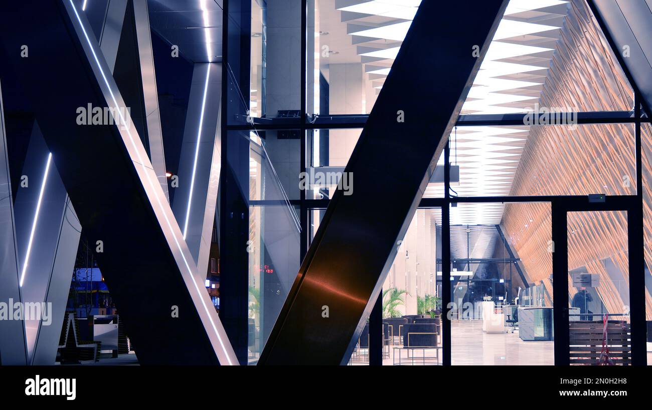 Combination of metal and glass wall material. Steel facade on columns ...