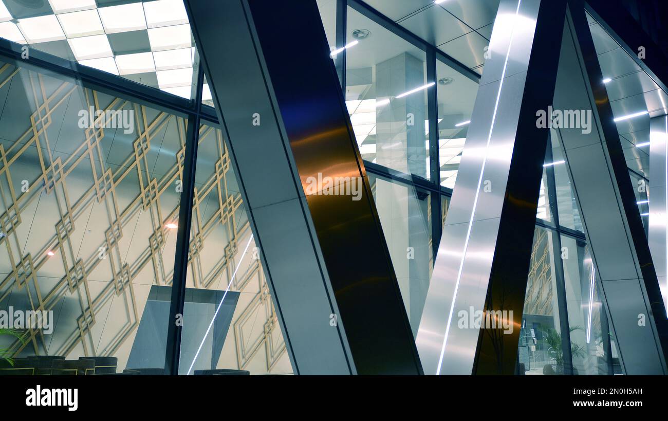 Combination of metal and glass wall material. Steel facade on columns ...