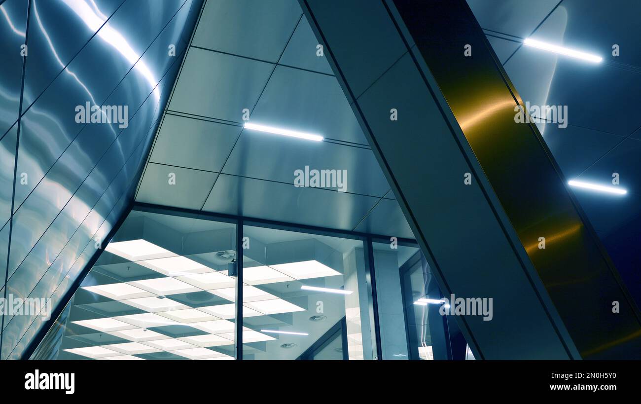 Combination of metal and glass wall material. Steel facade on columns ...