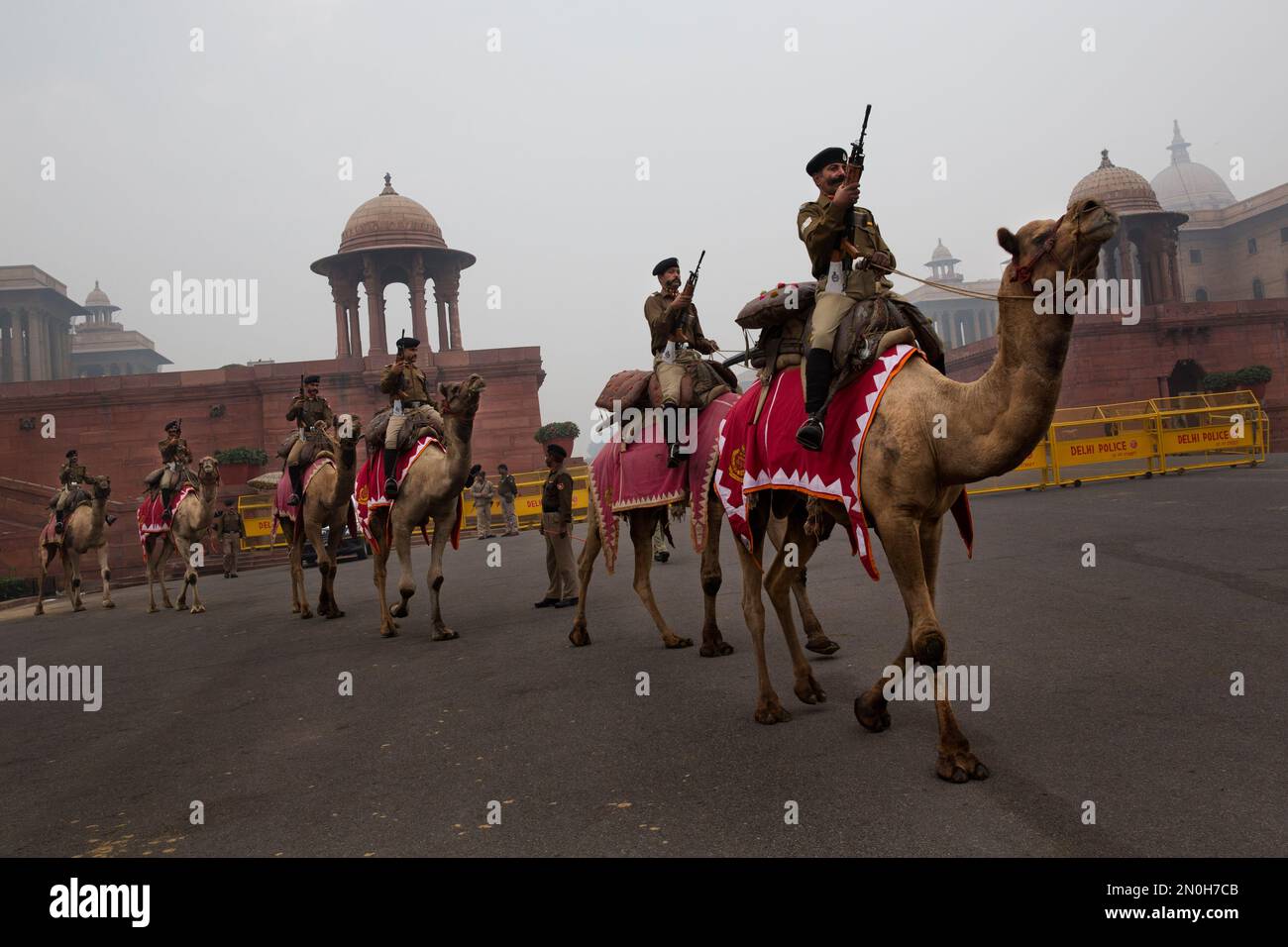 Camel mounted Border Security Force soldiers prepare to march during ...
