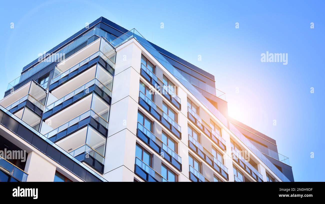 New apartment building with glass balconies. Modern architecture houses ...