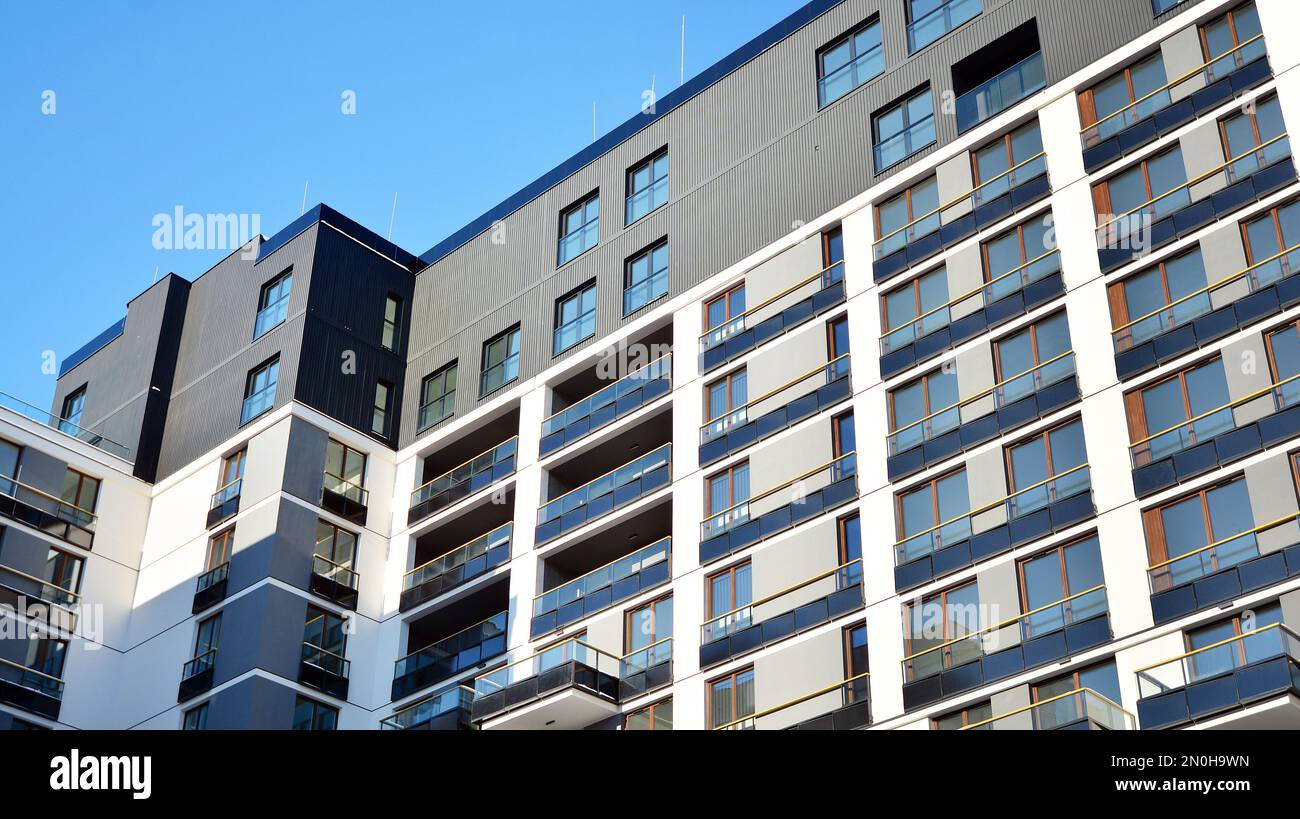 New apartment building with glass balconies. Modern architecture houses ...
