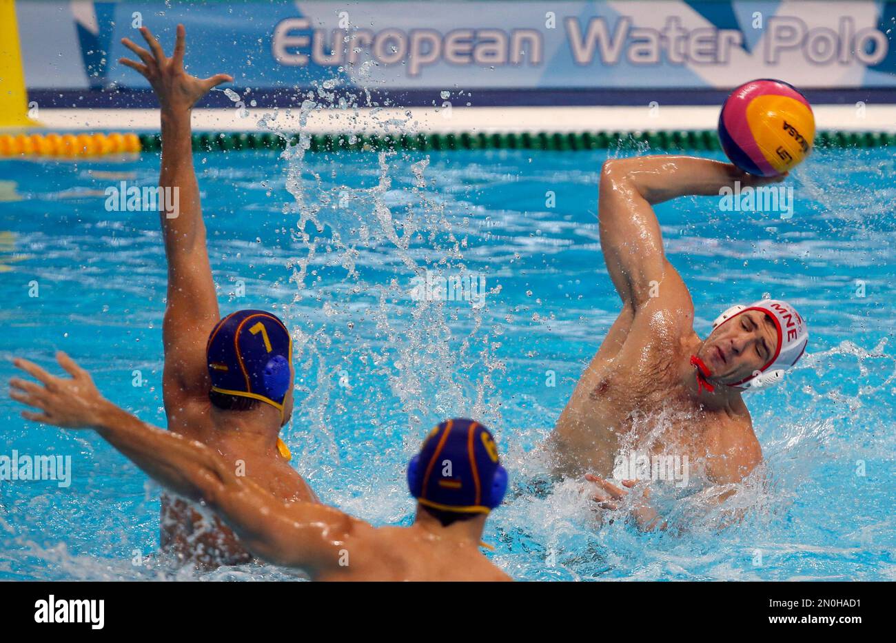 Montenegro's Aleksandar Radovic, right, shoots on goal as Spain's ...