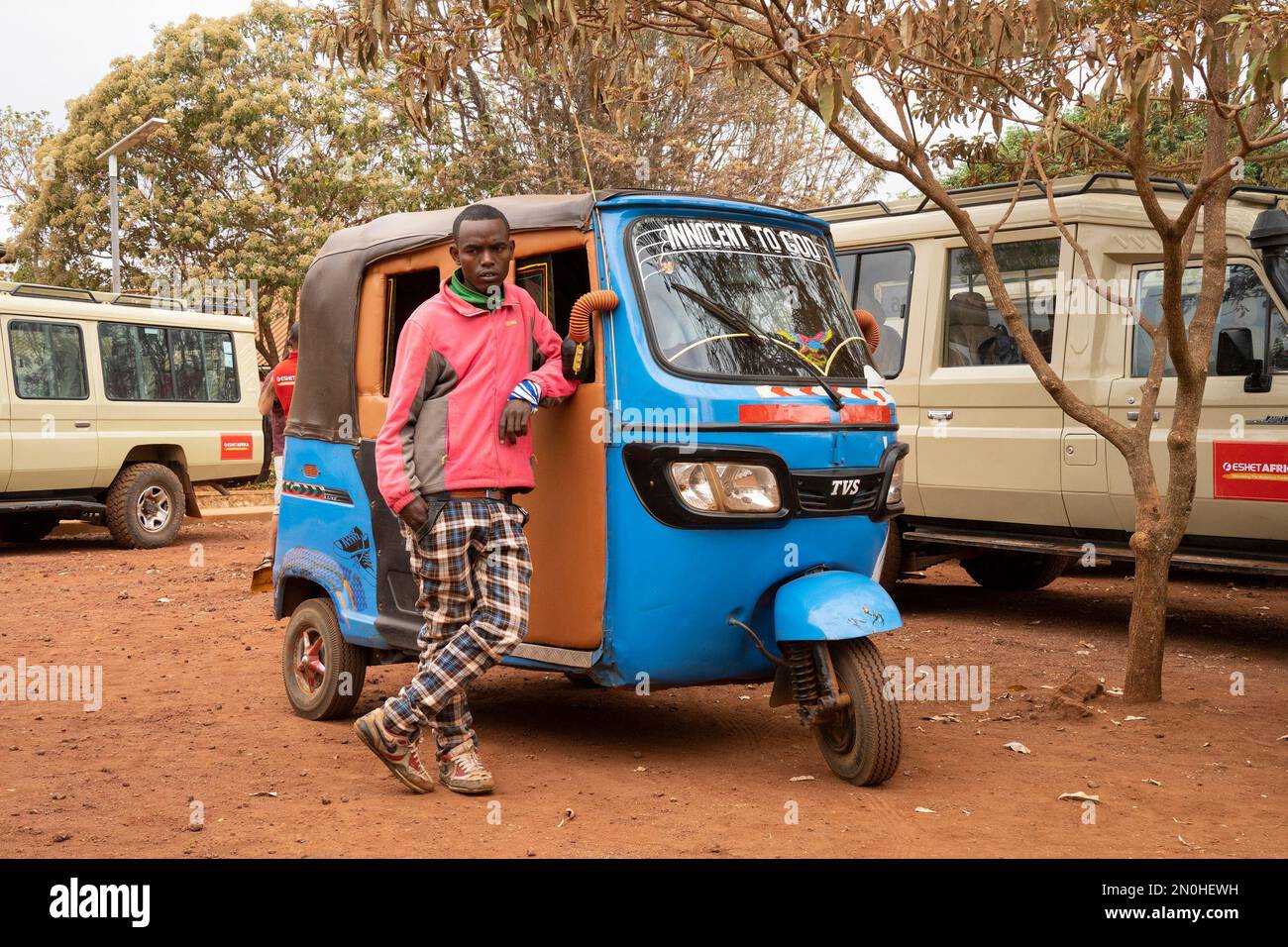 Karatu, Tanzania - October 16th, 2022: A driver waiting for passengers ...