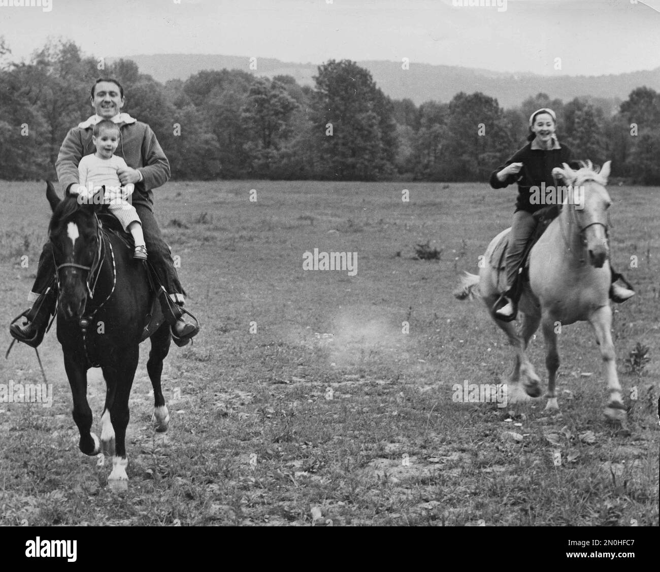 Talk show host Merv Griffin and his family enjoy riding horseback on ...