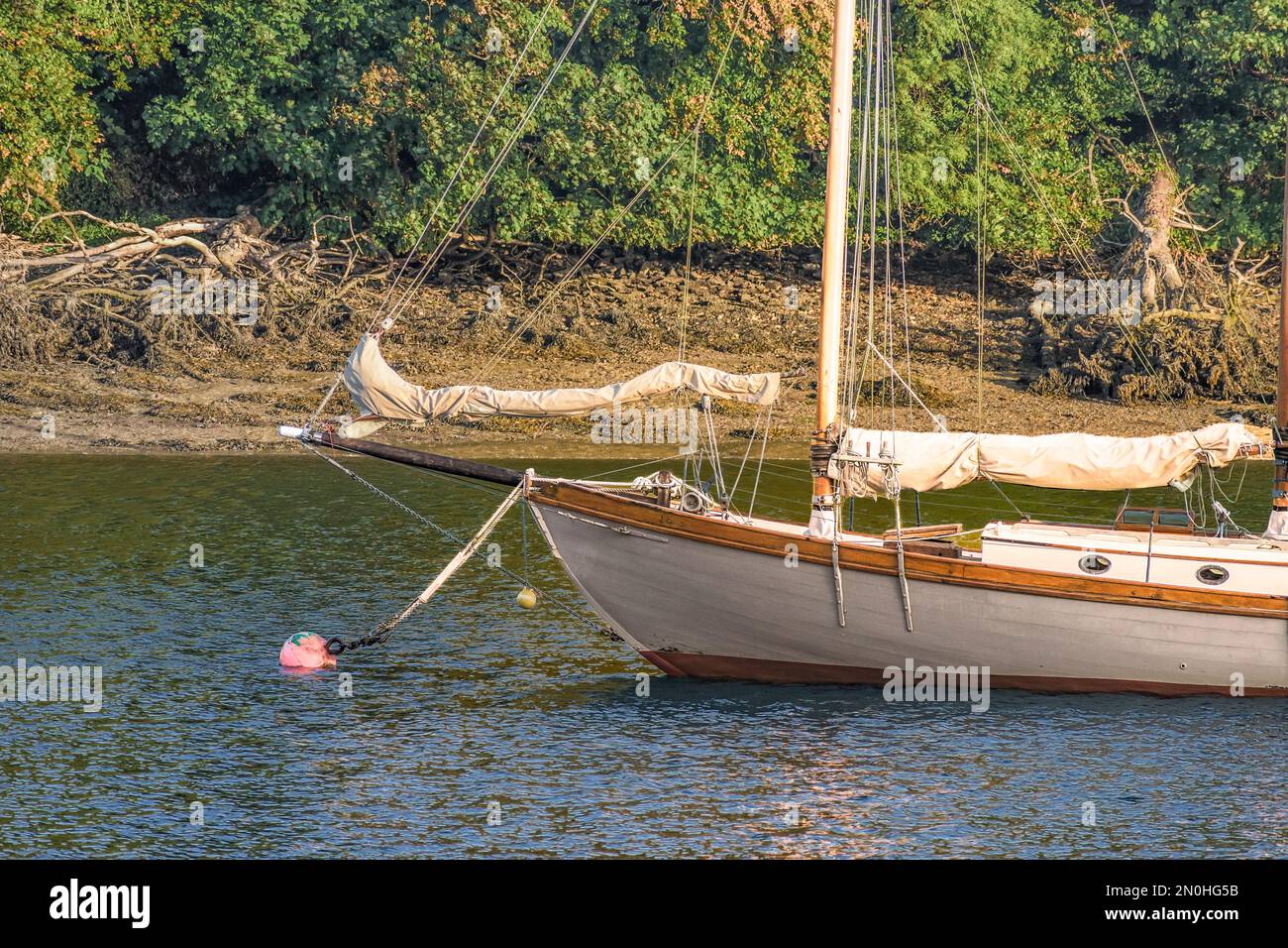 Traditional sailing boat moored at Owenabue river estuary. Crosshaven ...