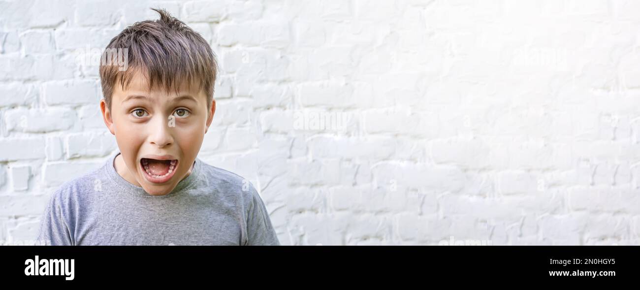 screaming Angry boy teenager with his mouth wide open and with open ...