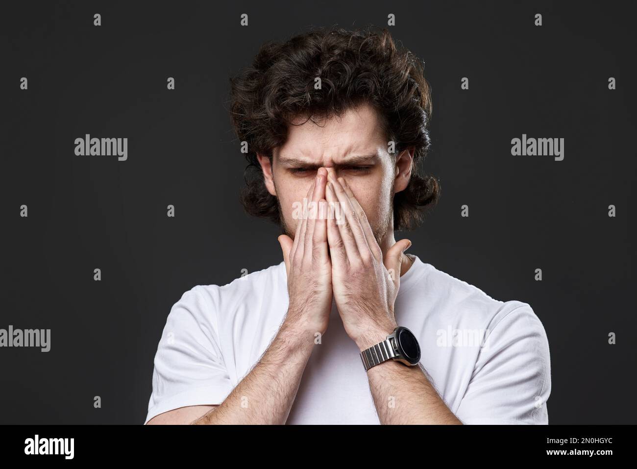 frustrated young man on dark gray background. sadness Stock Photo - Alamy