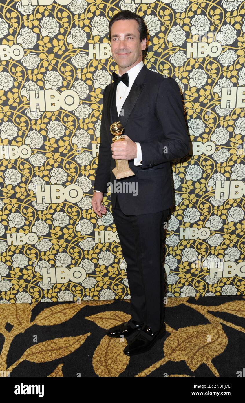 Jon Hamm poses with the award for best performance by an actor in a TV ...