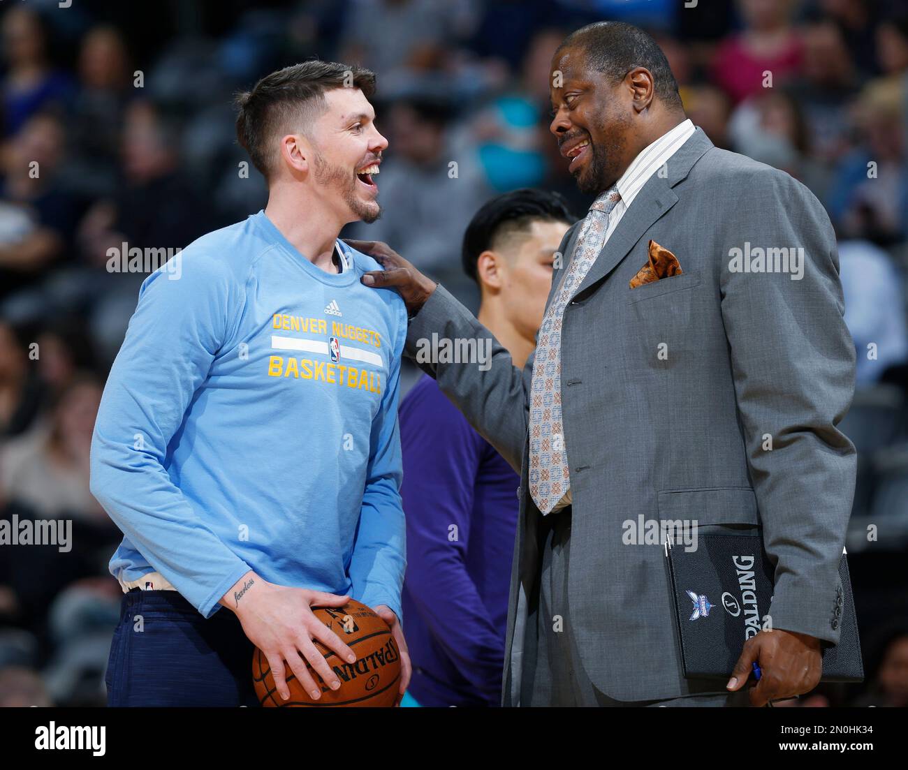 Denver Nuggets guard Mike Miller, left, jokes with Charlotte Hornets ...