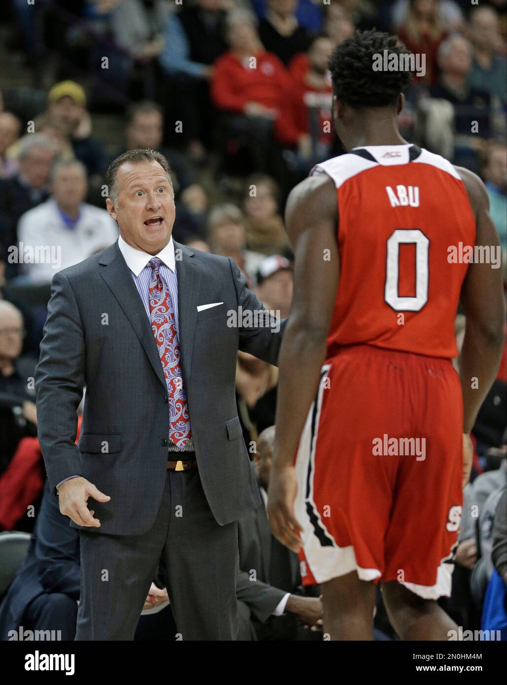 North Carolina State head coach Mark Gottfried, left, talks with Abdul ...