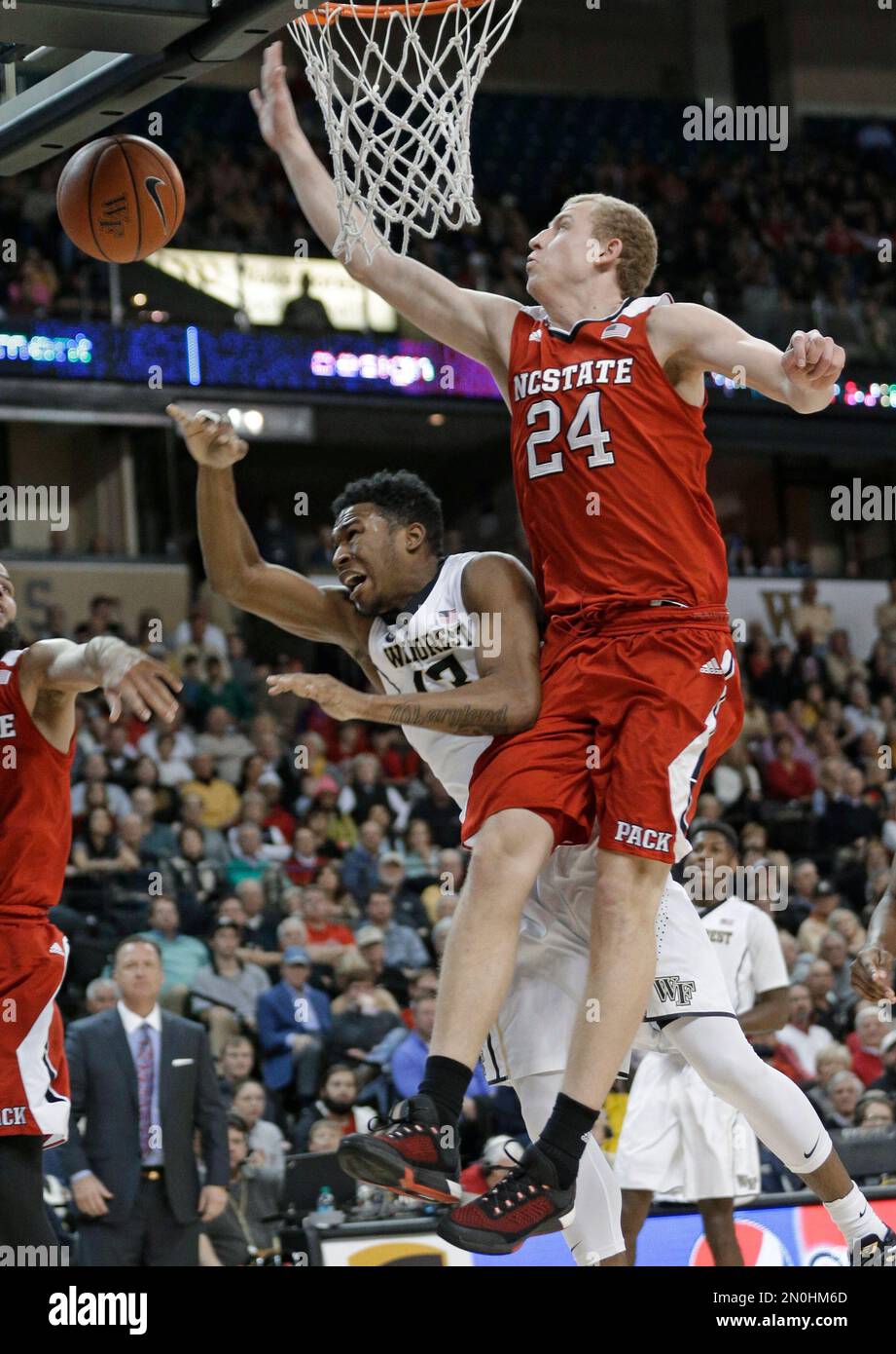 Wake Forest's Bryant Crawford (13) is fouled by North Carolina State's ...