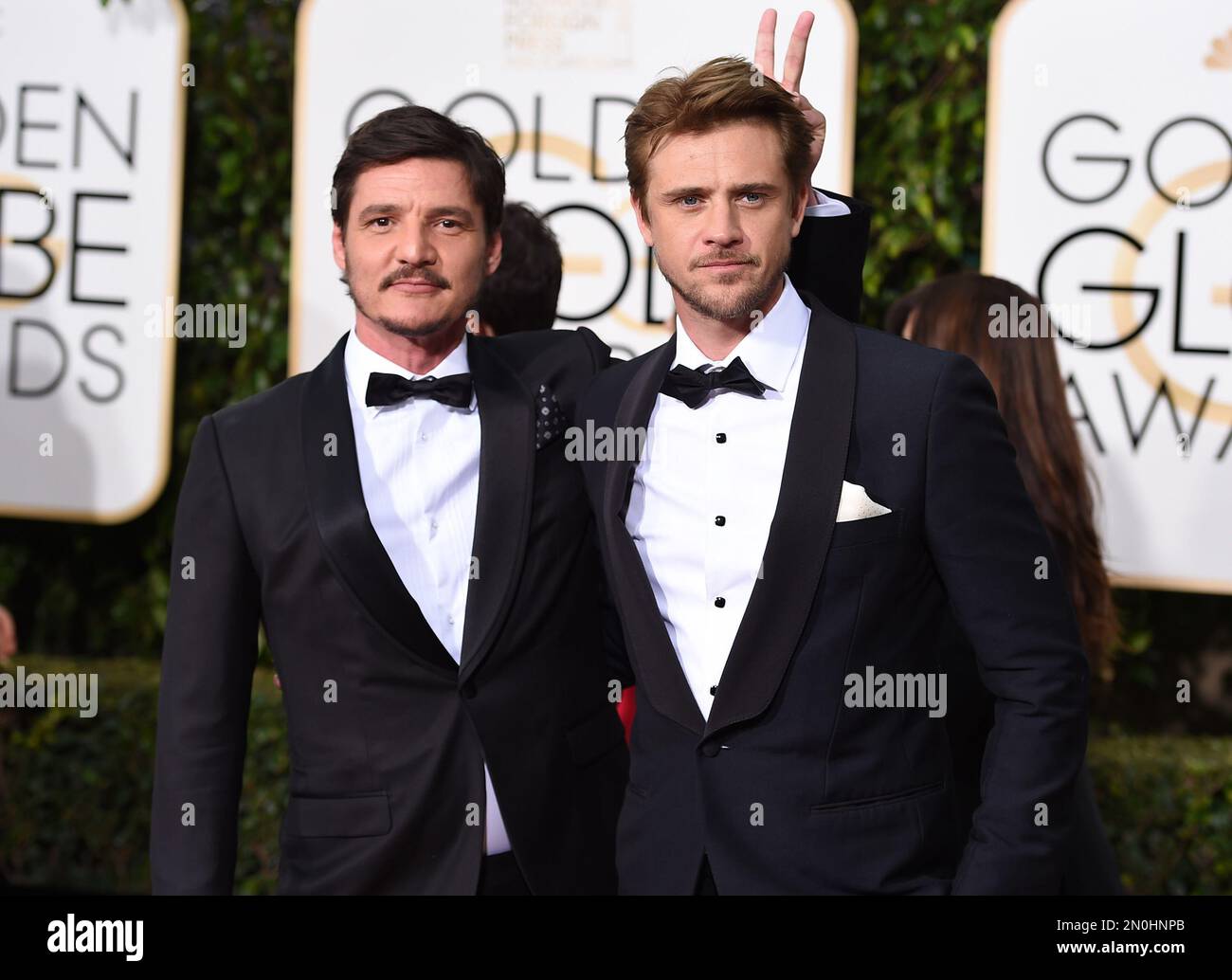 Pedro Pascal, left, and Boyd Holbrook arrive at the 73rd annual Golden ...