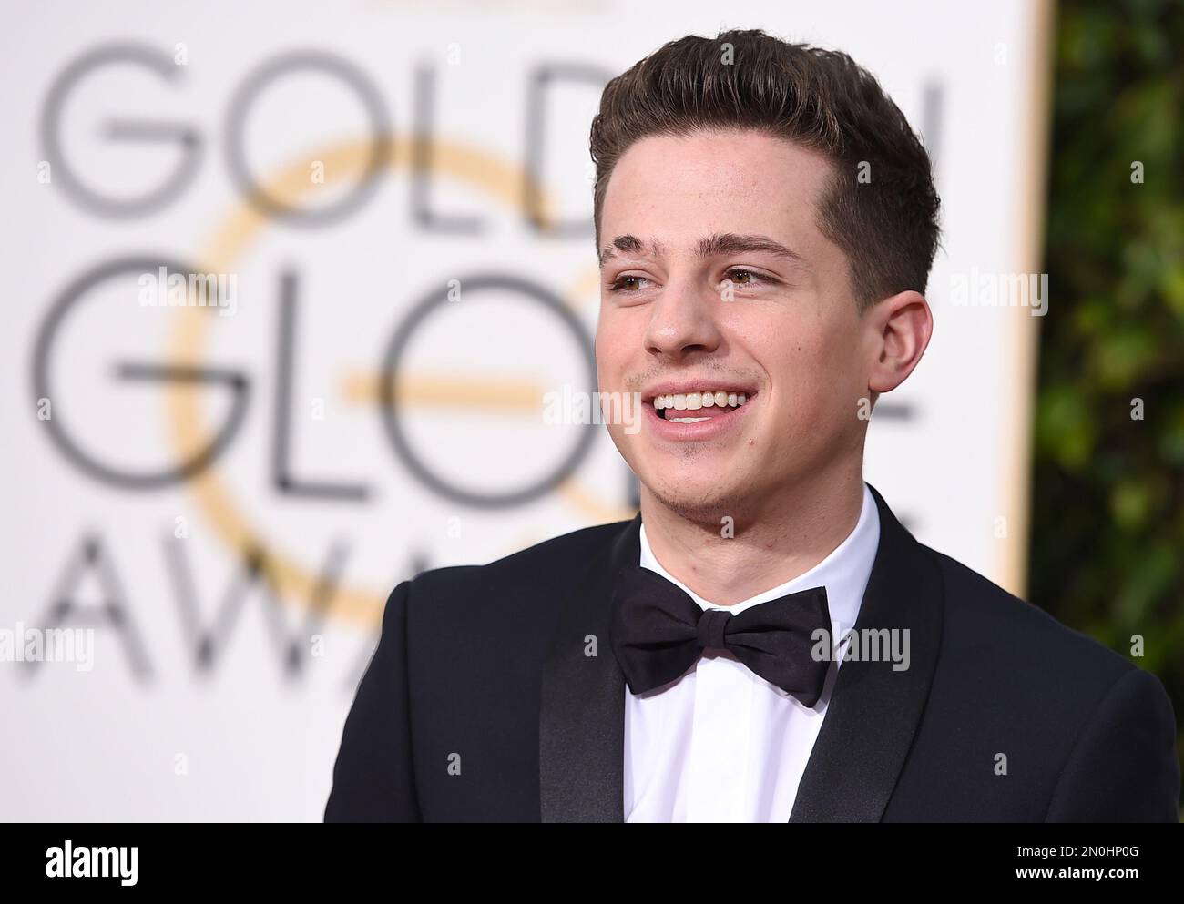 Charlie Puth arrives at the 73rd annual Golden Globe Awards on Sunday ...
