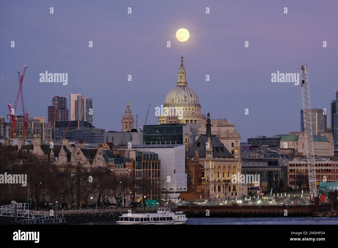 London, UK. 5th February, 2023. The full Snow Moon rises behind St Paul ...
