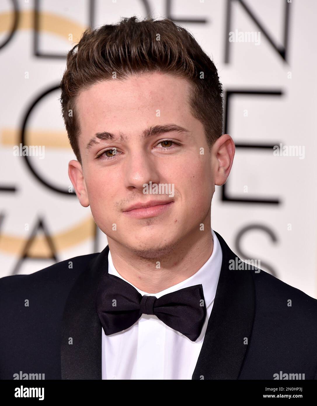 Charlie Puth arrives at the 73rd annual Golden Globe Awards on Sunday ...