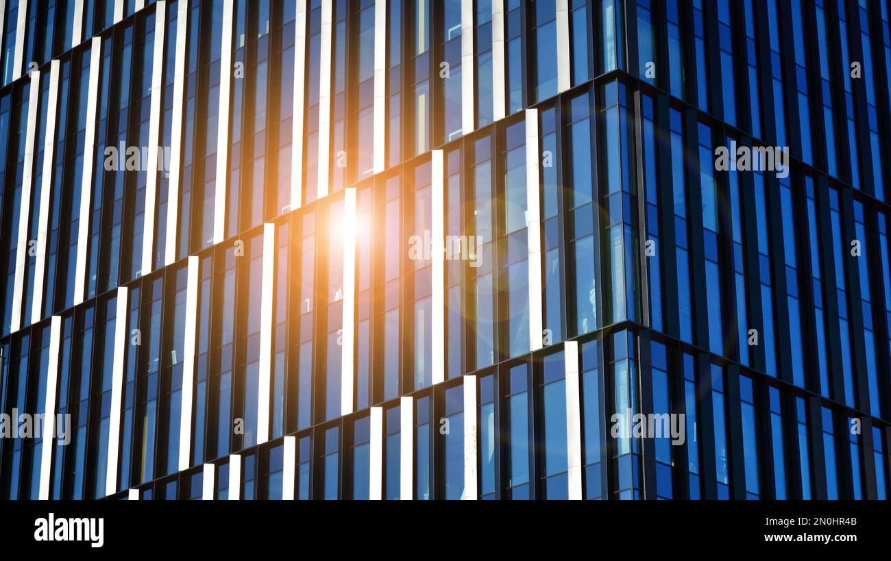 Office building, details of blue glass wall and sun reflections Stock ...