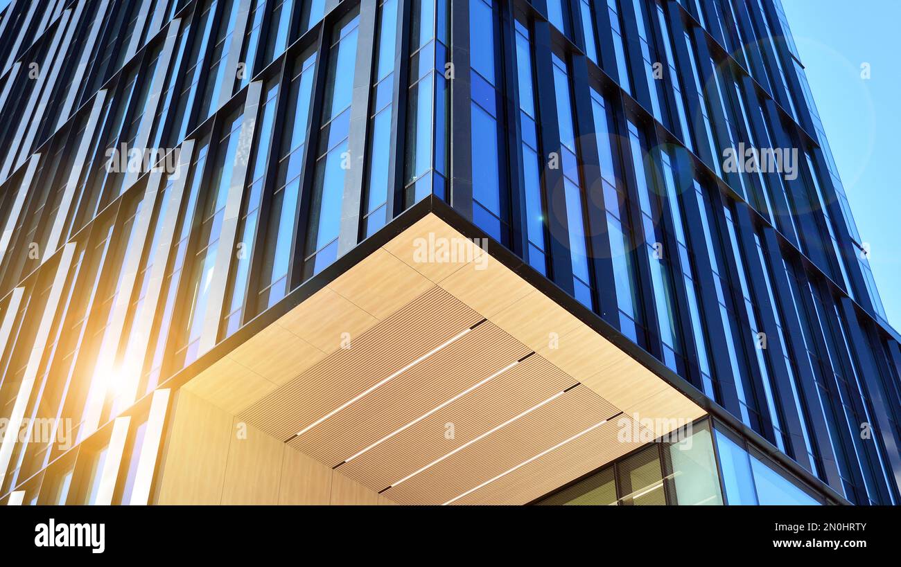 Office building, details of blue glass wall and sun reflections Stock ...