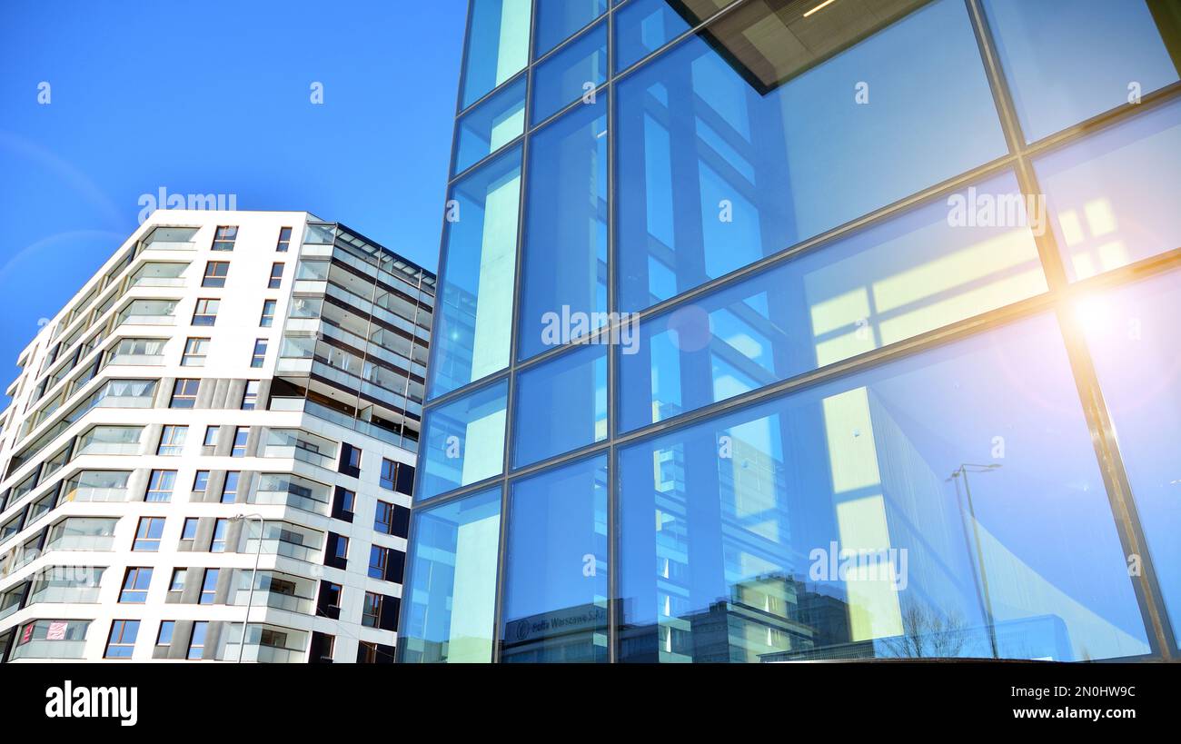 Office building, details of blue glass wall and sun reflections Stock ...